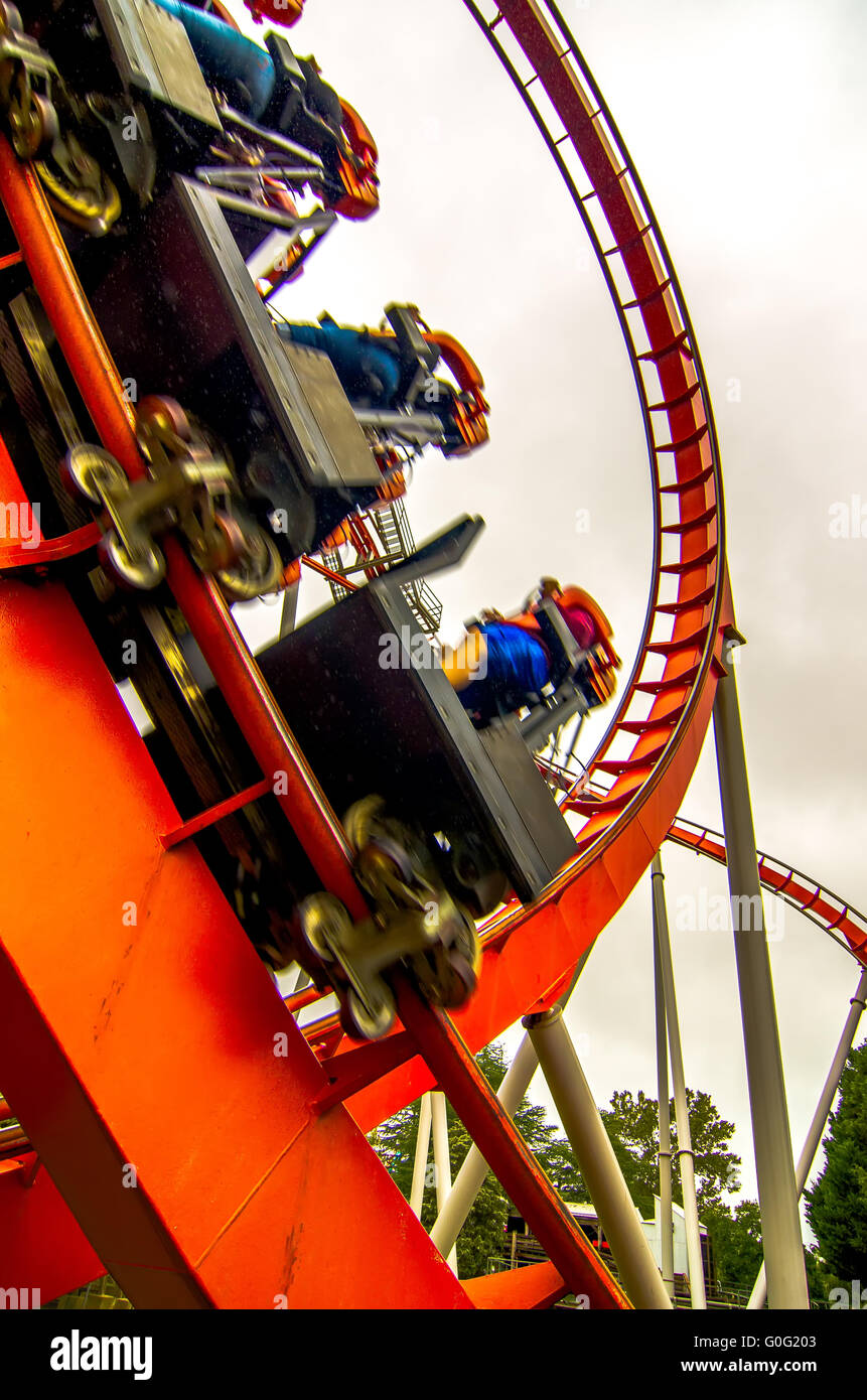 crazy rollercoaster rides at amusement park Stock Photo - Alamy