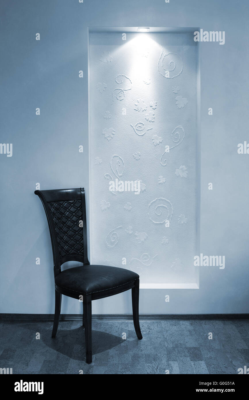 Beautiful modern leather chair at a wall Stock Photo - Alamy