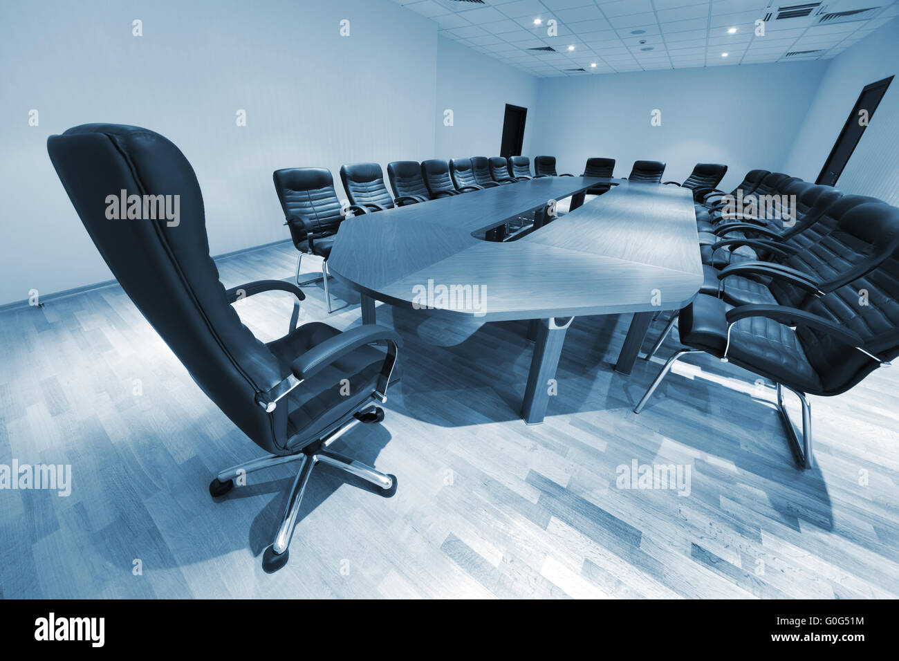a large table and chairs in a modern conference room Stock Photo - Alamy