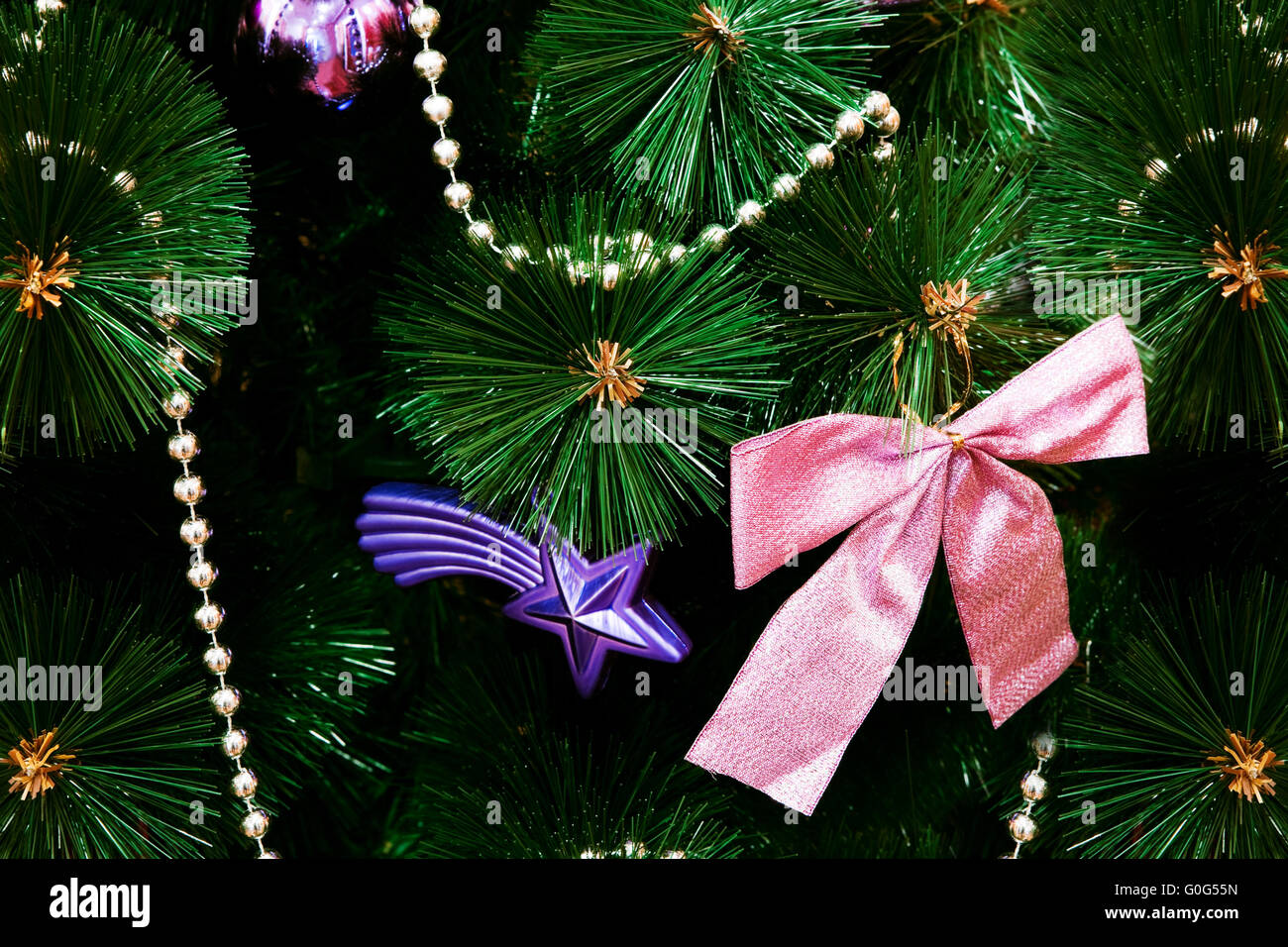 pink bow on the artificial Christmas tree Stock Photo - Alamy