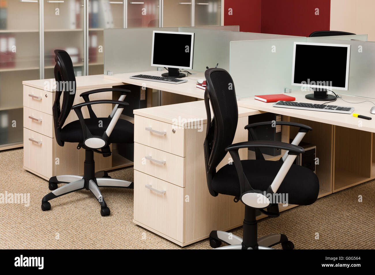 computers behind the glass in a modern office Stock Photo - Alamy