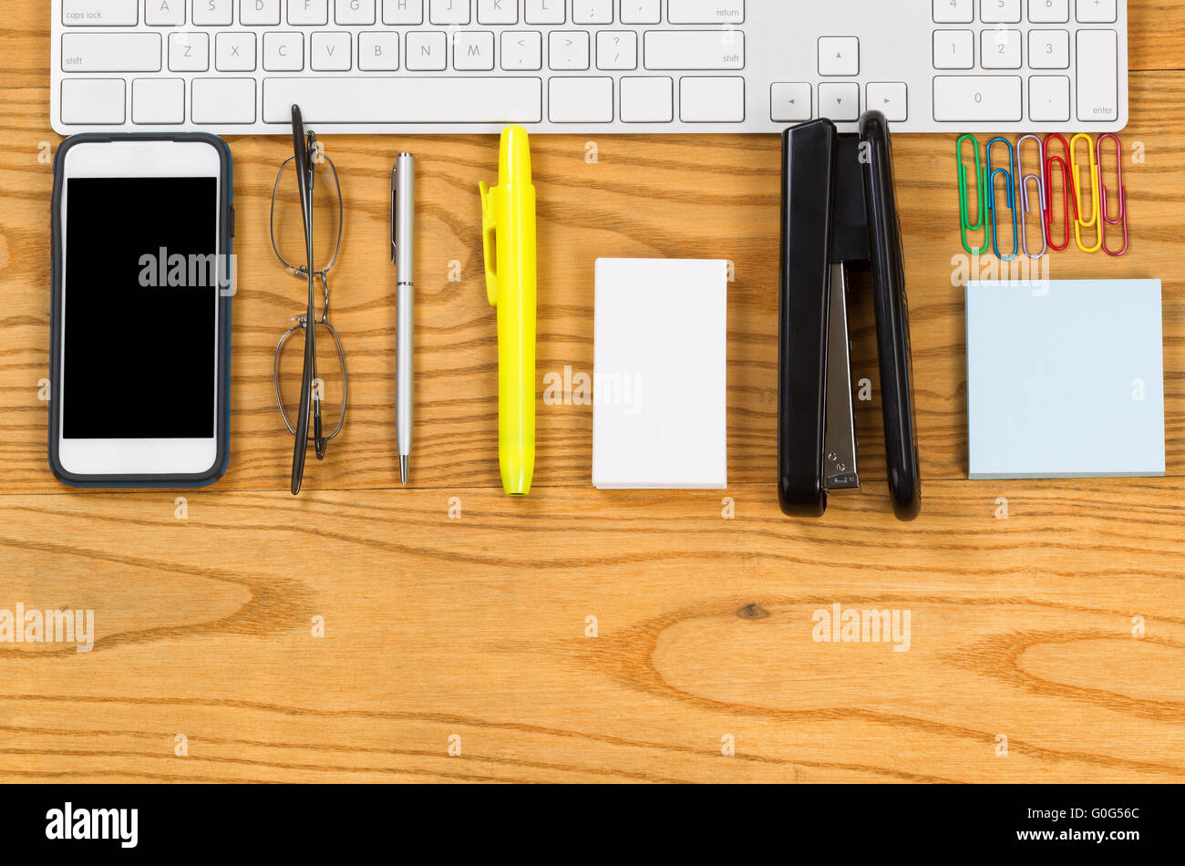 Office work supplies align with computer keyboard on desktop Stock ...