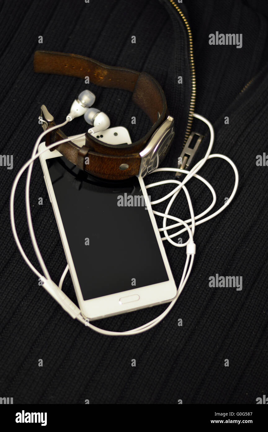 Smartphone and retro watch Stock Photo - Alamy