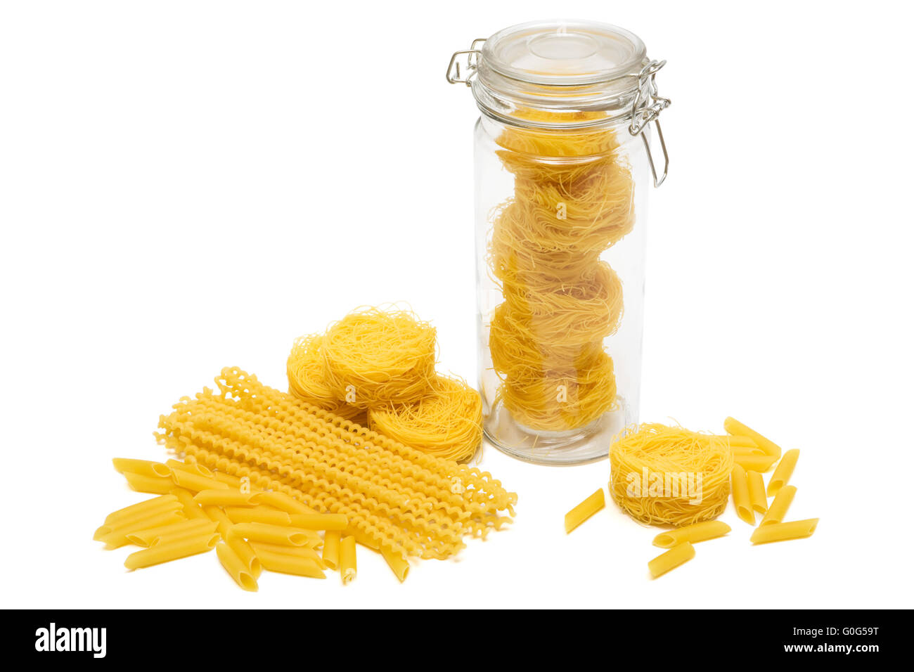 pasta in glass jar on a white background Stock Photo - Alamy