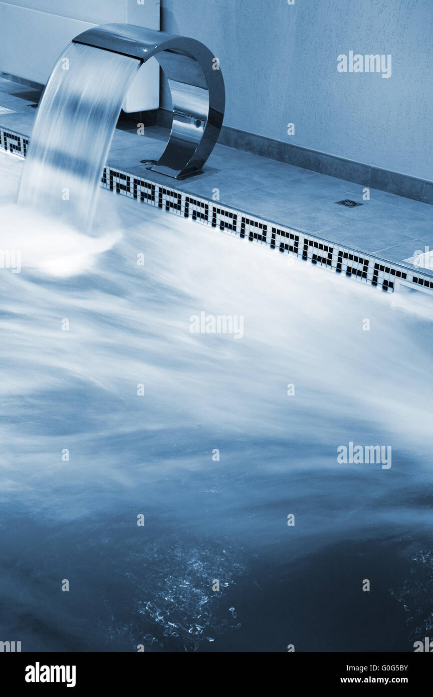 Stream of water current in beautiful pool Stock Photo - Alamy