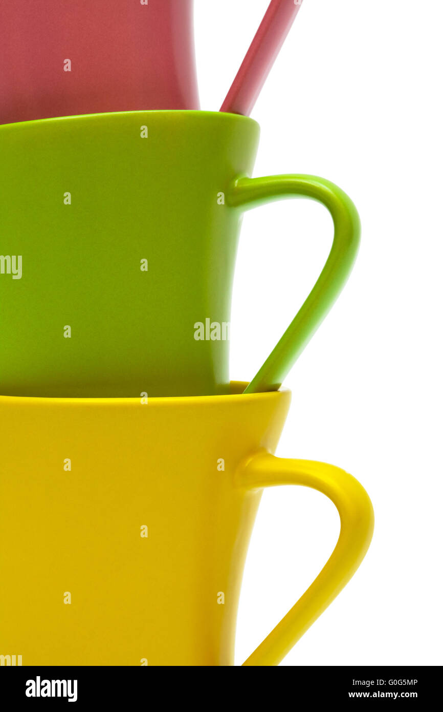 Beautiful color cups on a white background Stock Photo - Alamy