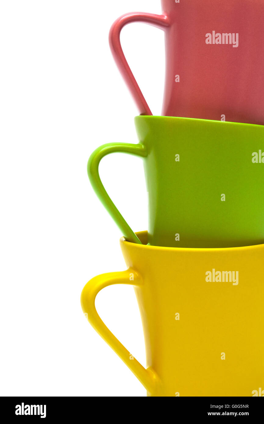Beautiful color cups on a white background Stock Photo - Alamy