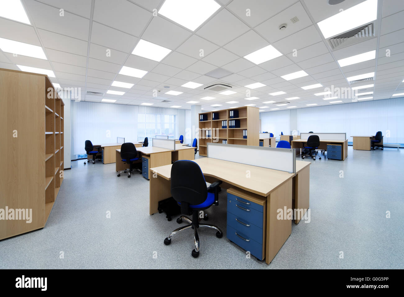 desks and bookcases in the modern office Stock Photo - Alamy