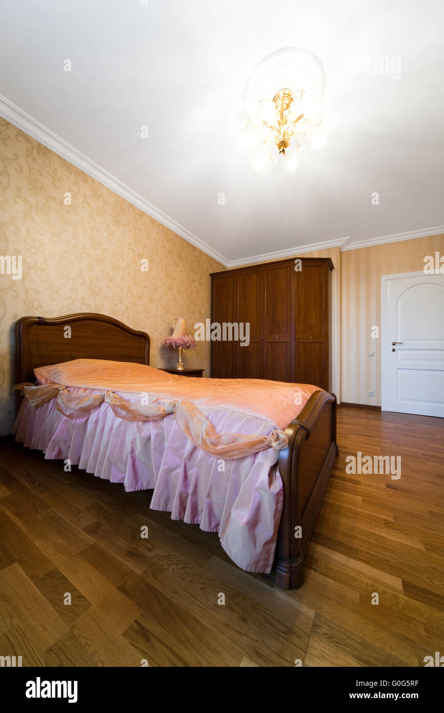 beautiful pink bed in a modern bedroom Stock Photo - Alamy