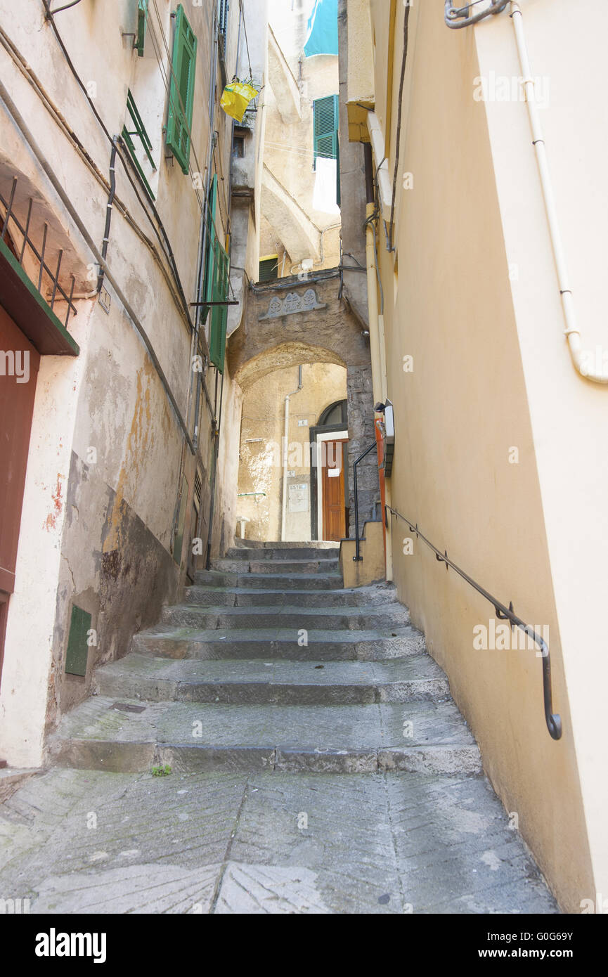 ITALY EMPIRE - JULY 14, 2014: View of the alley with stairs up to the ...