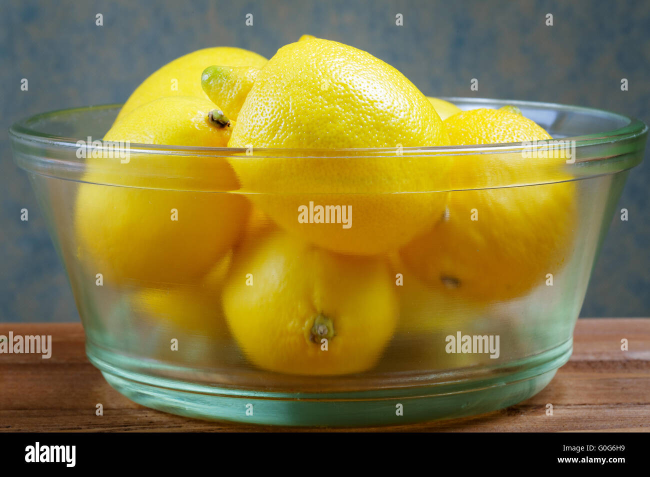 Lemons in a glass plate close up Stock Photo - Alamy