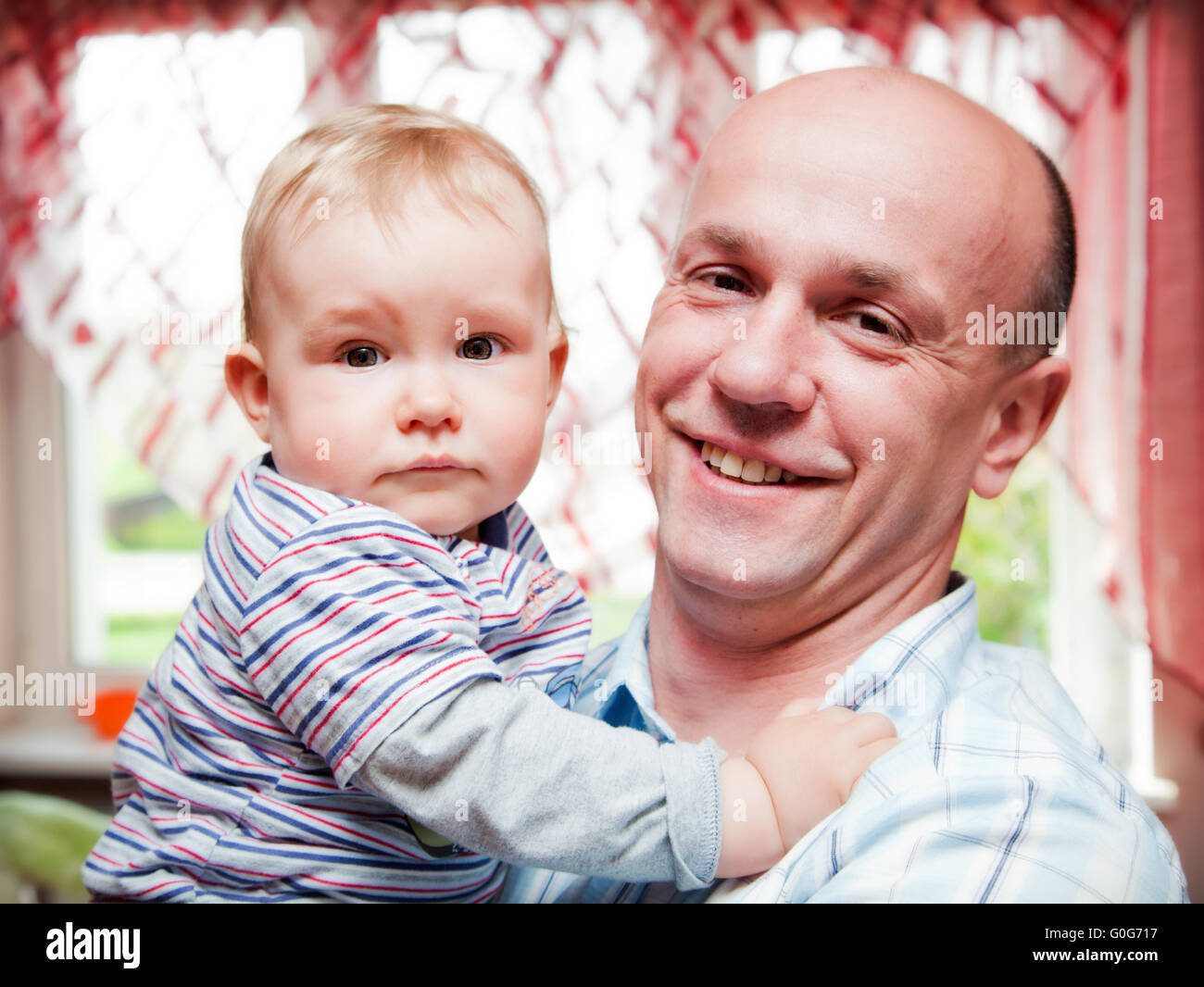 Father with his little baby son portrait in home Stock Photo - Alamy