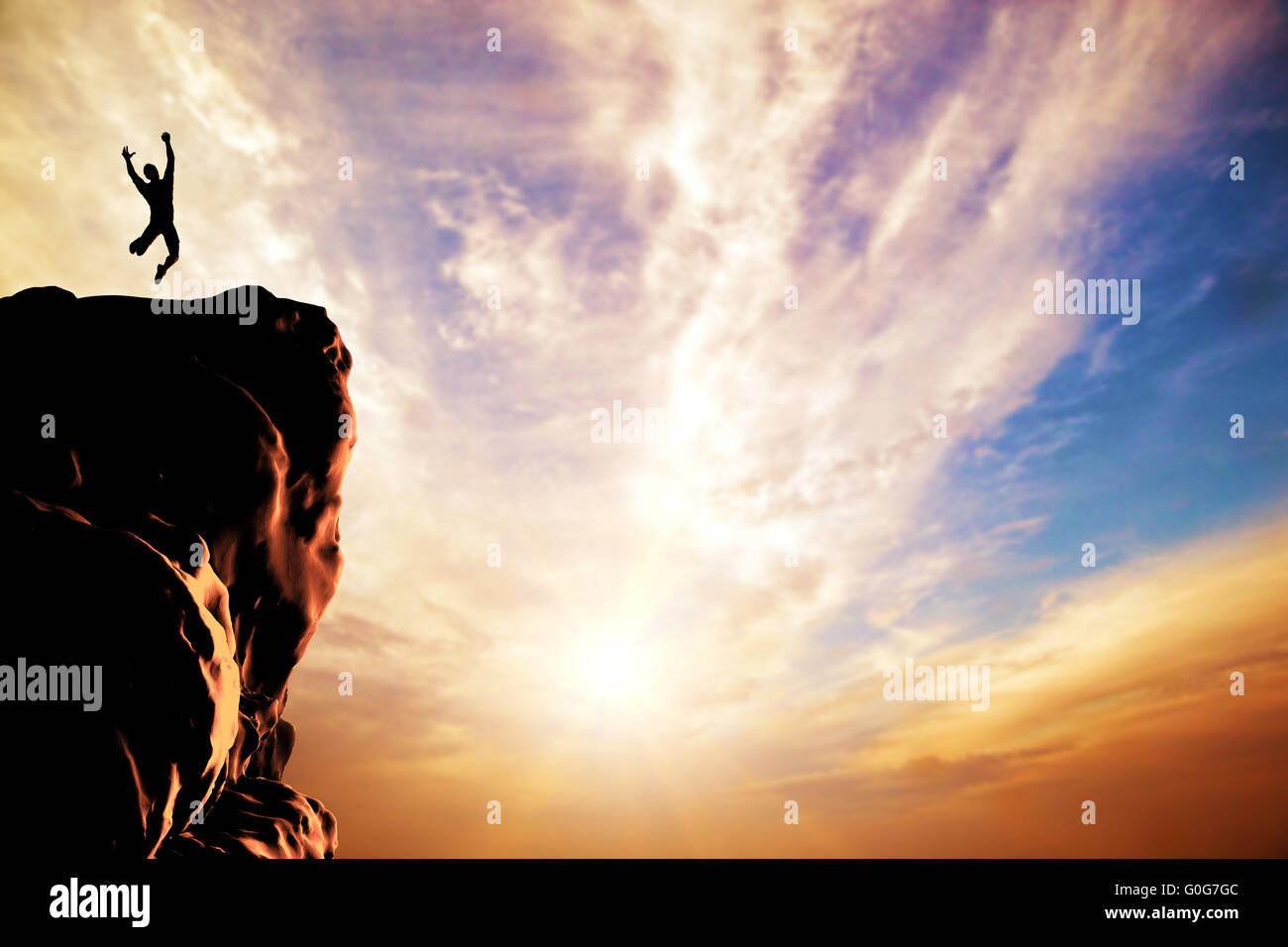 Happy man jumping for joy on the top of the mountain Stock Photo - Alamy