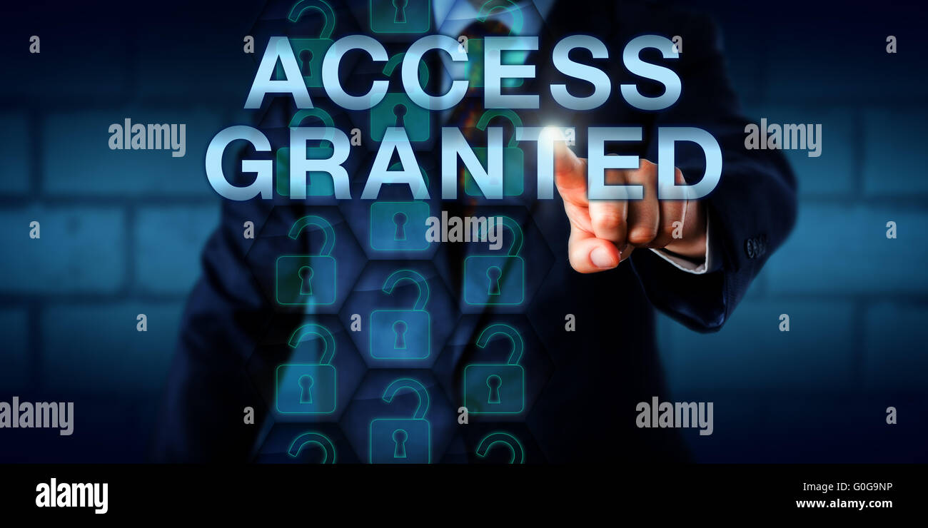 Corporate User Touching ACCESS GRANTED Onscreen Stock Photo - Alamy