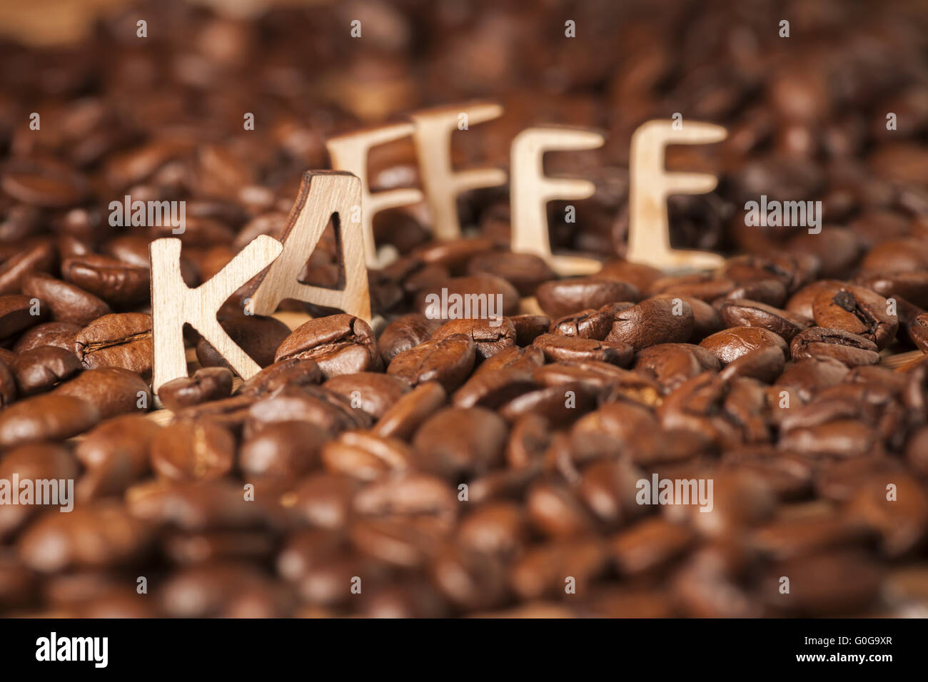 Letters on coffee beans Stock Photo - Alamy