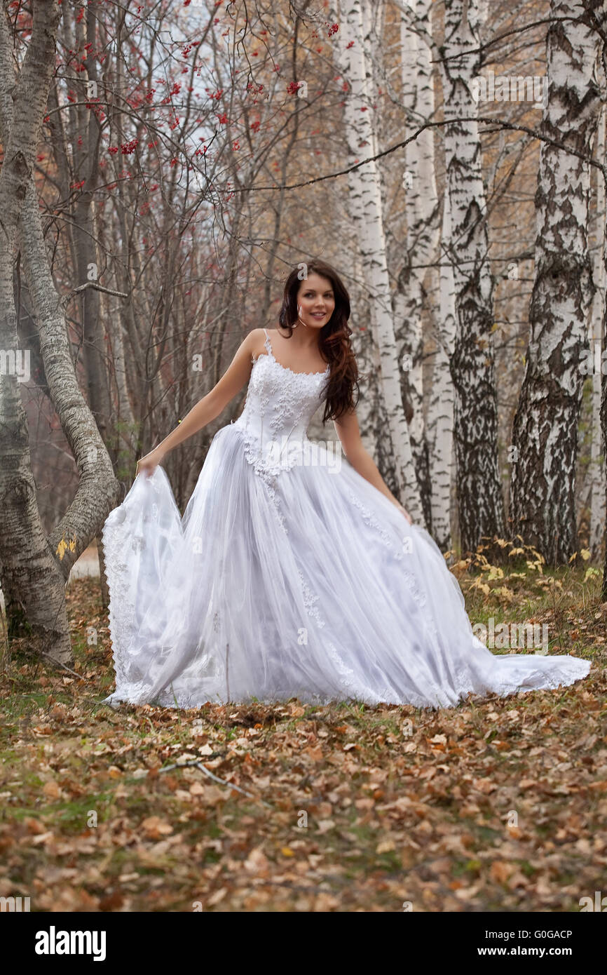 Young Bride In A Forest Stock Photo - Alamy