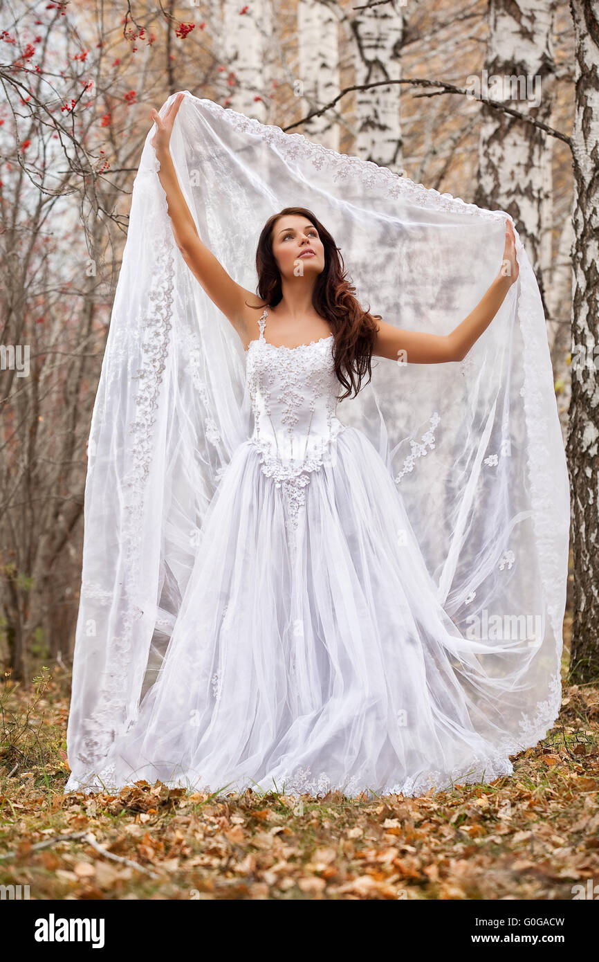 Young Bride In A Forest Stock Photo - Alamy