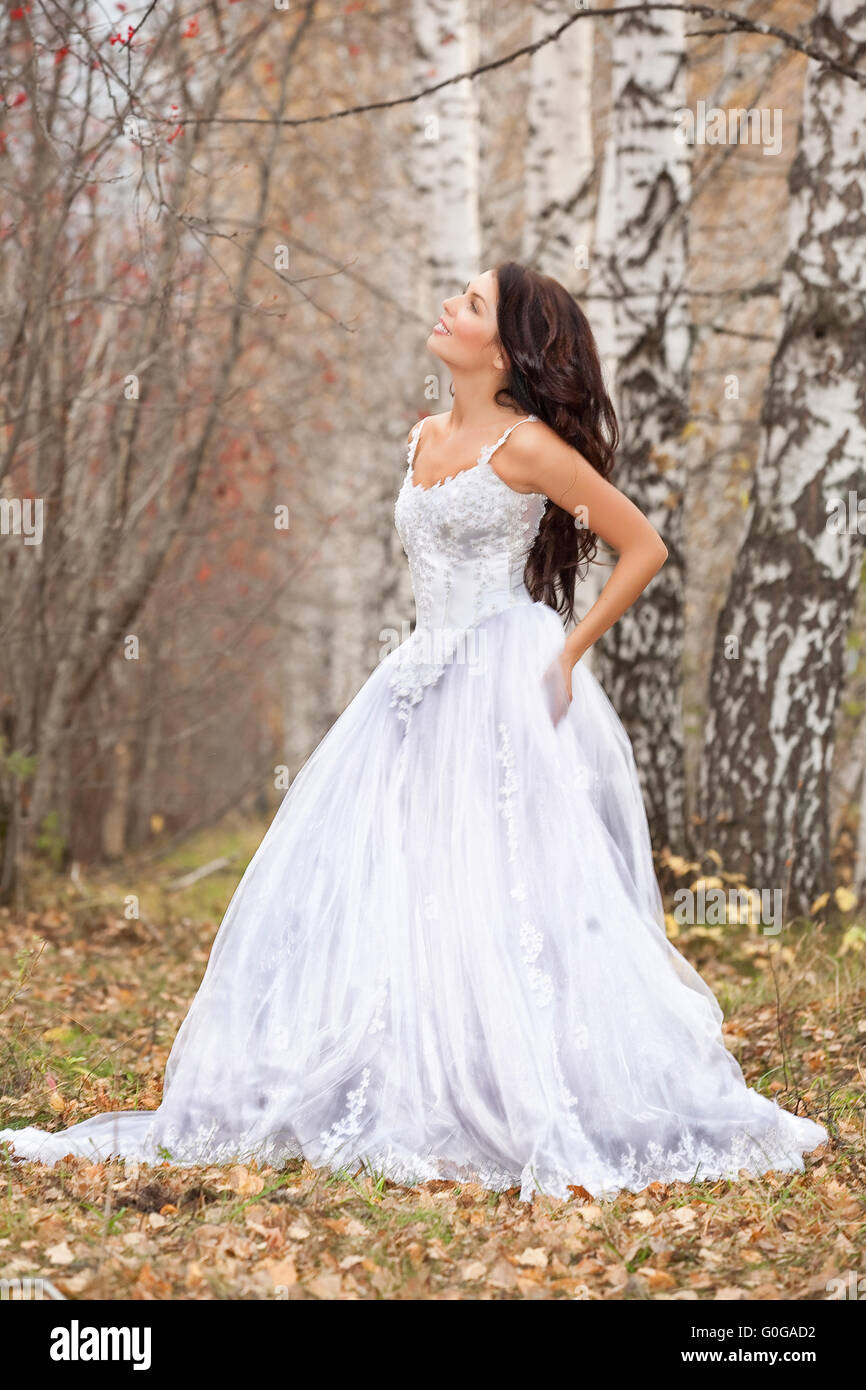 Young Bride In A Forest Stock Photo - Alamy