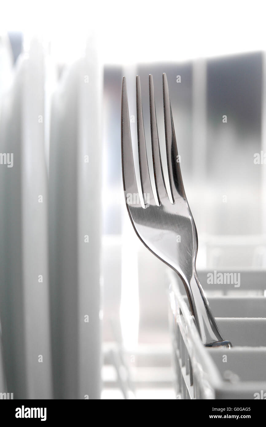 fork in a dish-washer Stock Photo - Alamy