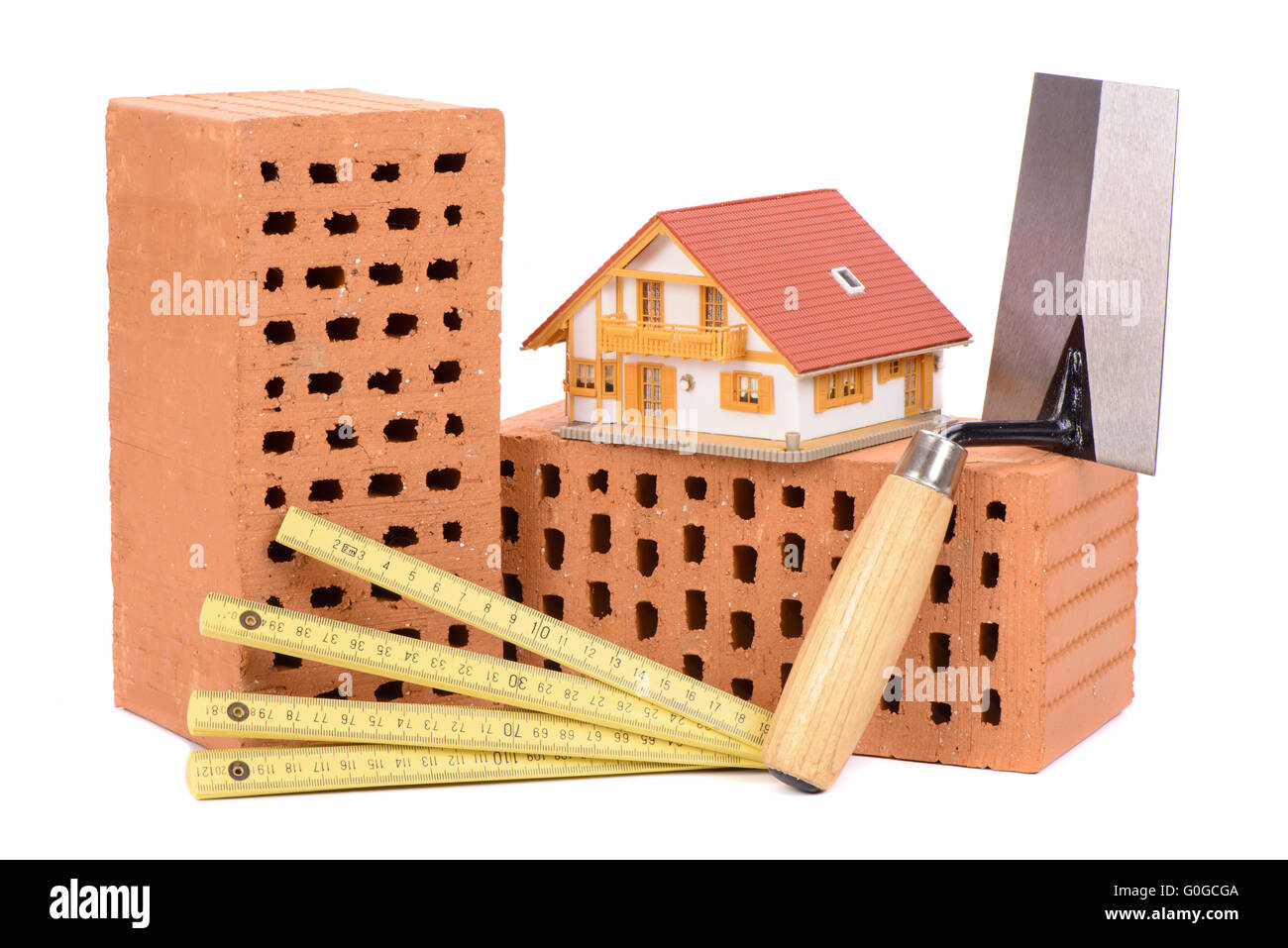 brick and tool for house construction Stock Photo - Alamy