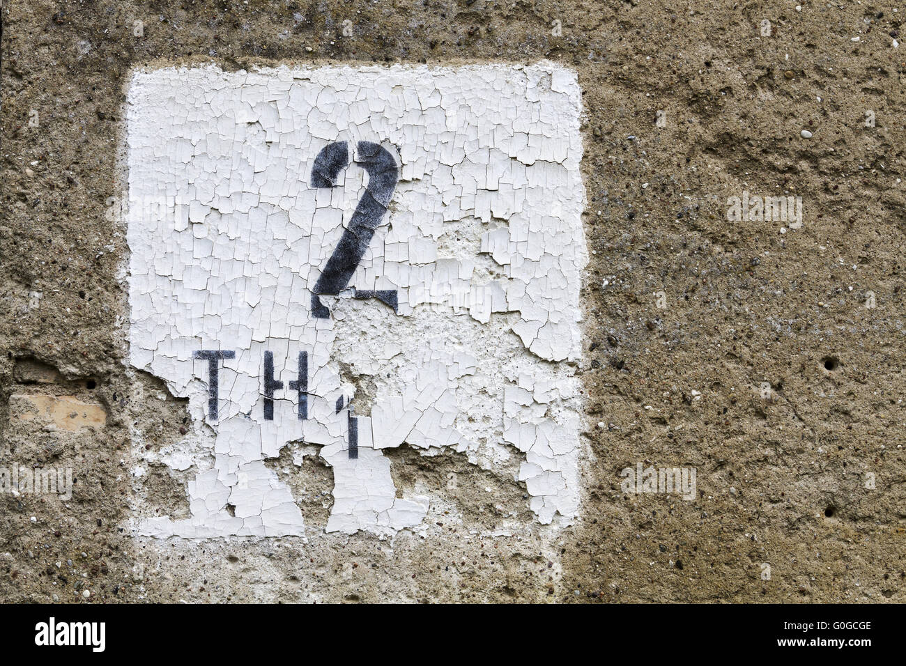 old flaking sign at house wall Stock Photo - Alamy