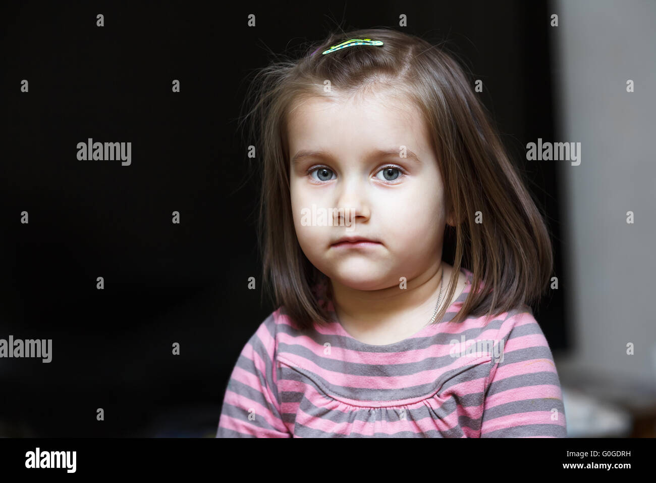 Serious little girl Stock Photo - Alamy