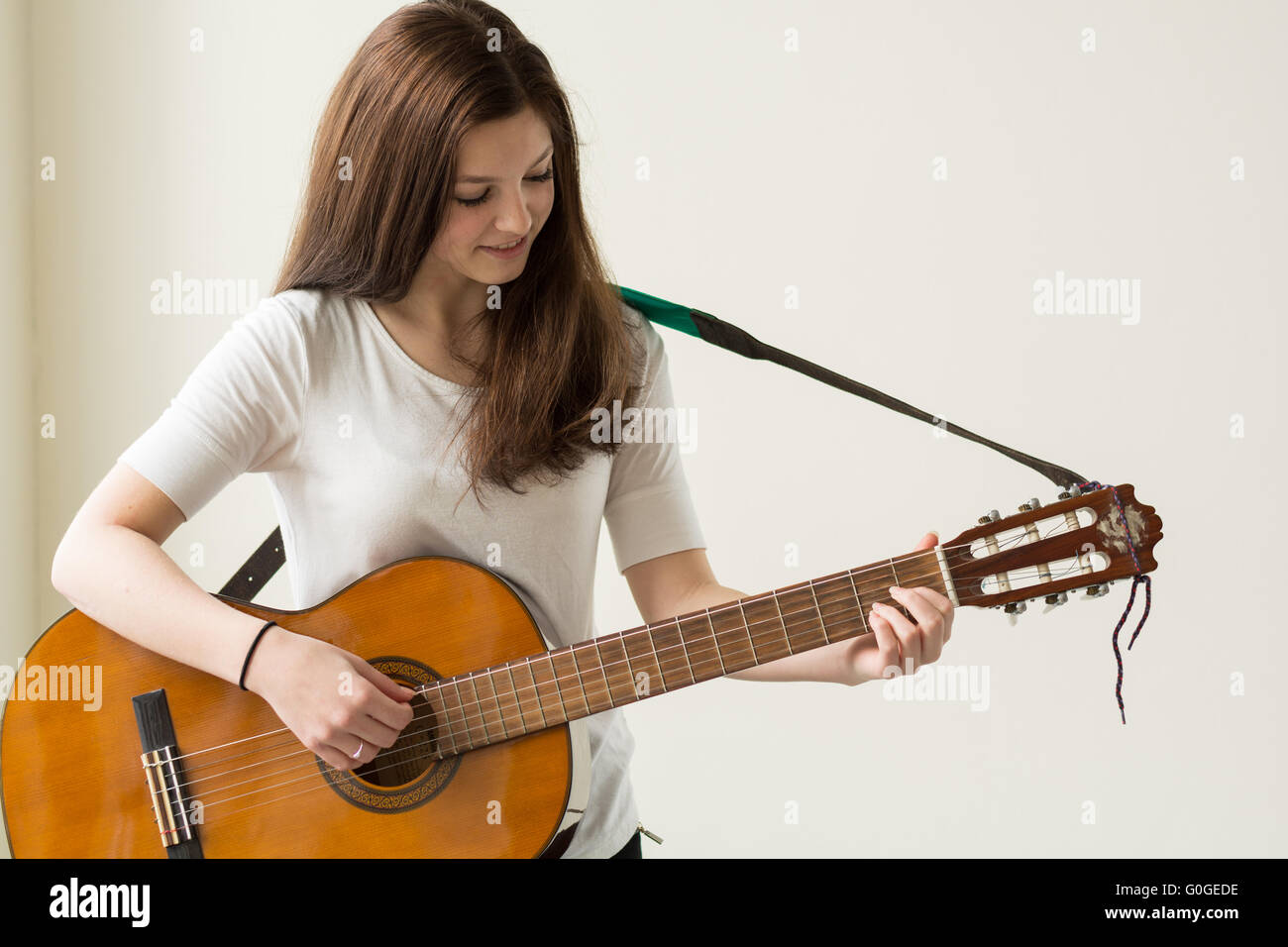 Teenagers playing musical instruments hi-res stock photography and ...