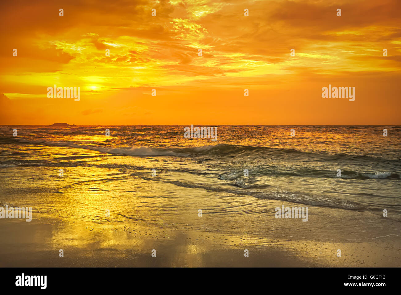Sunset over the sea Stock Photo - Alamy