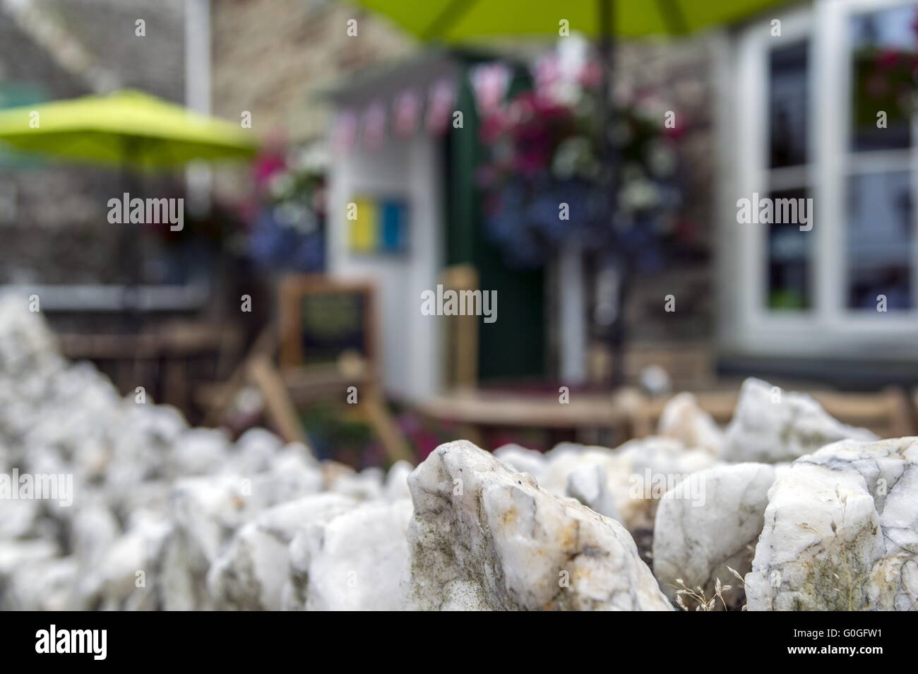 Wall made of stones in front of a coaching inn on the north coast of ...