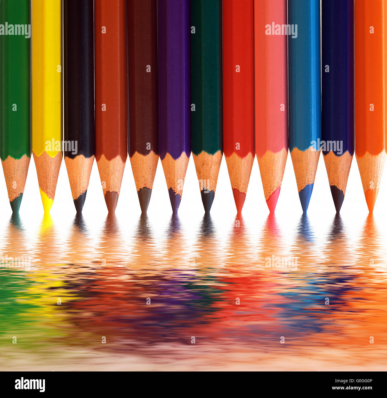 Colorful pencils arranged as a color pallete with abstract reflection ...
