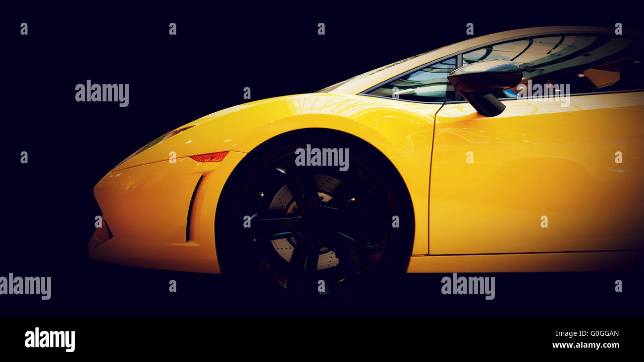 Modern fast car close-up side view on black. Luxury Stock Photo - Alamy