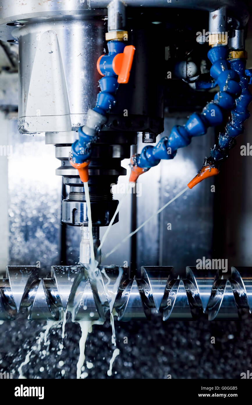 CNC machining station at work. Milling, threading industry Stock Photo ...