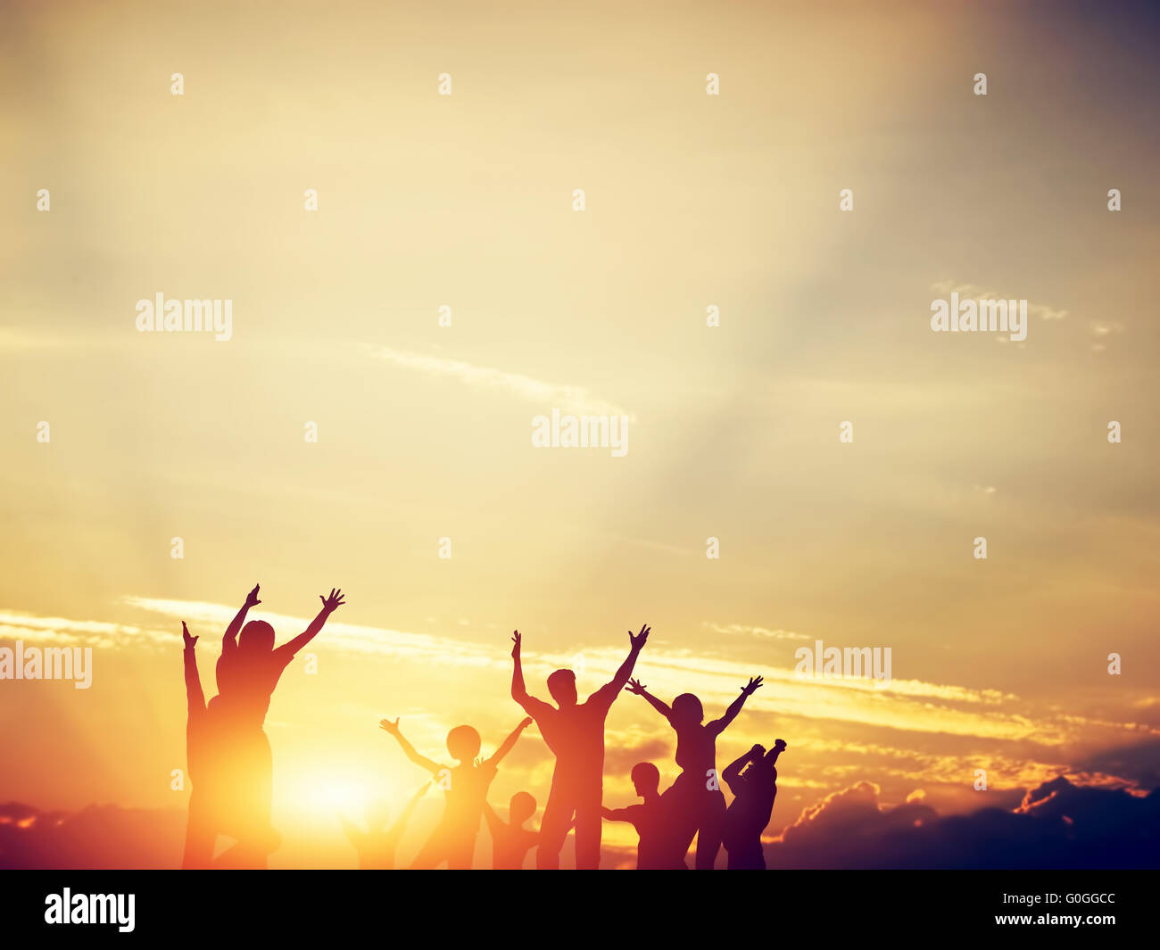 Happy friends, family jumping together at sunset Stock Photo - Alamy