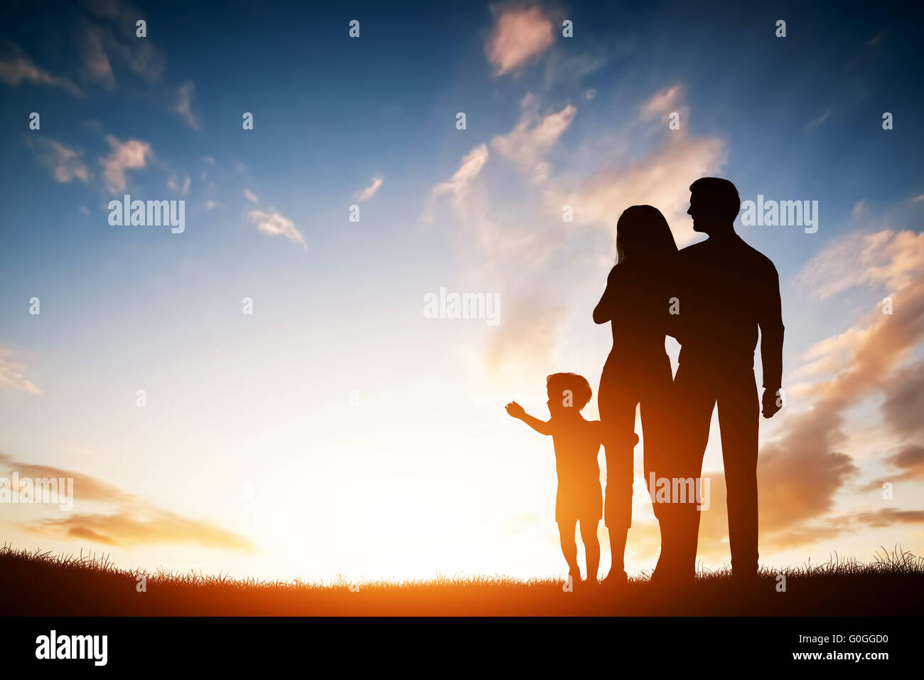 Happy Family Together Parents With Their Little Child At Sunset Stock