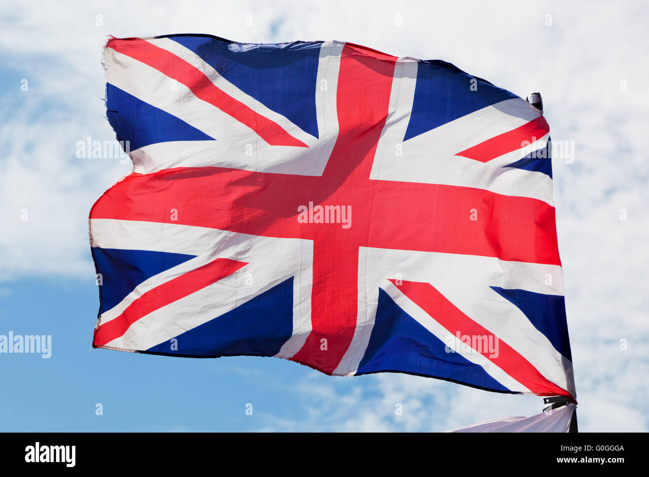 The Union Jack, the national flag of the United Kingdom waving on wind ...