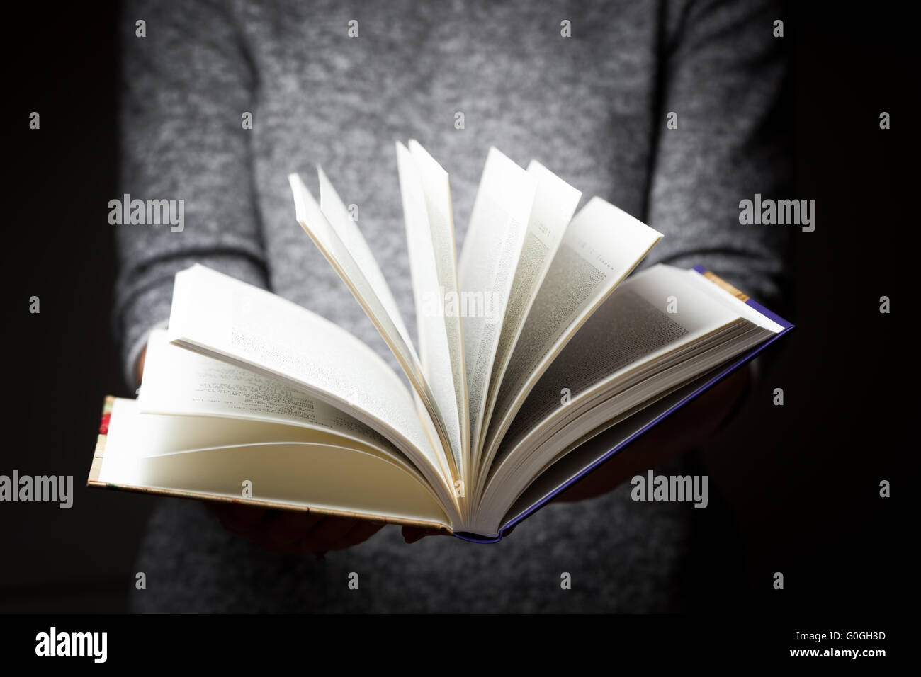 Person reading book hands hi-res stock photography and images - Alamy