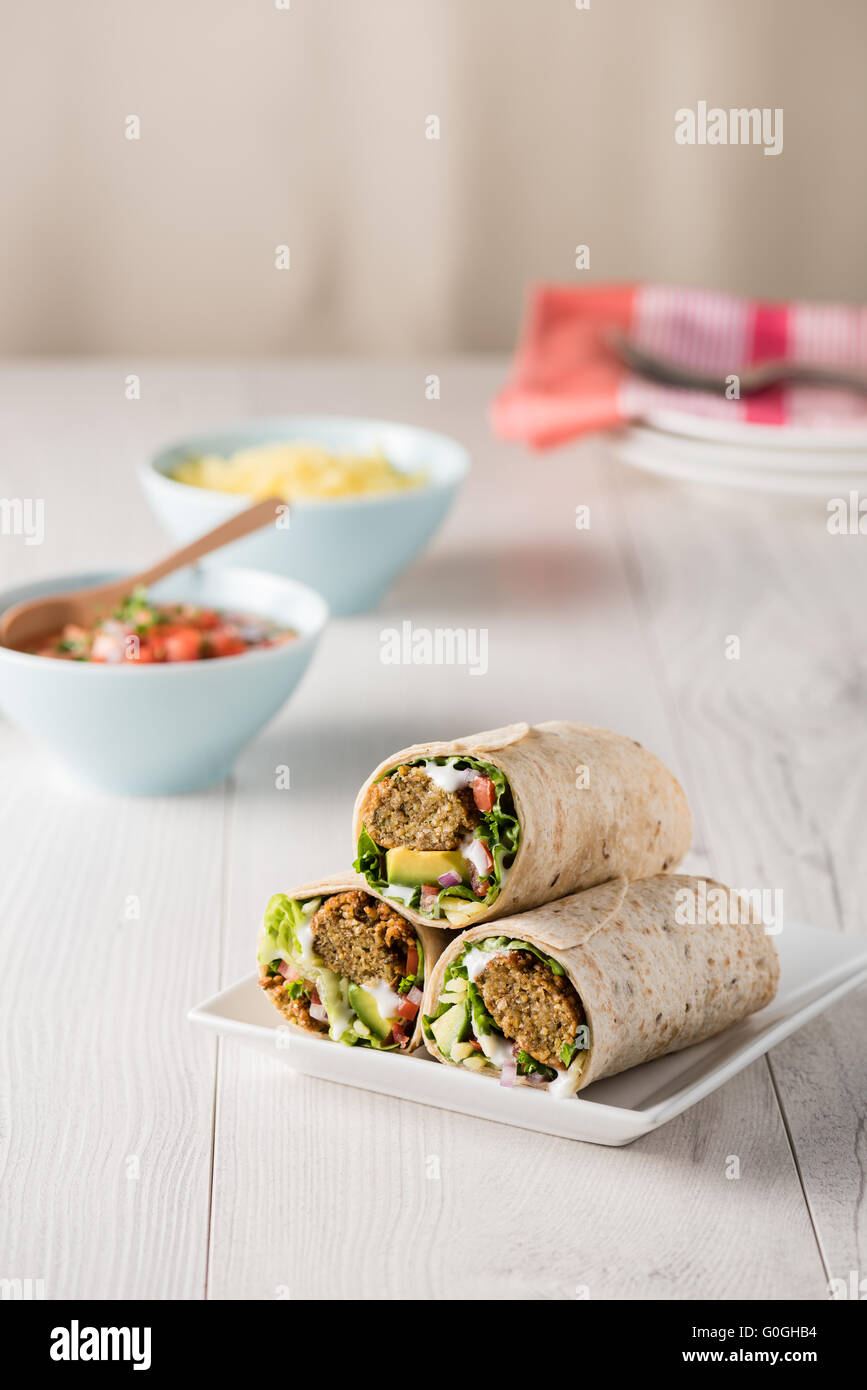 Vegetarian falafel wraps with avocado and cheese Stock Photo - Alamy