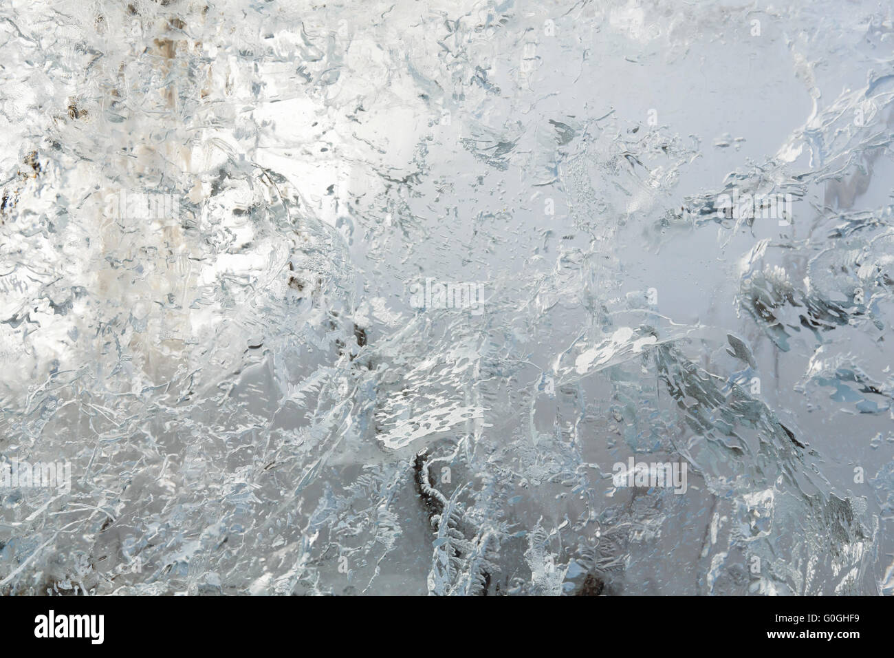 Glacial transparent block of ice with patterns Stock Photo - Alamy