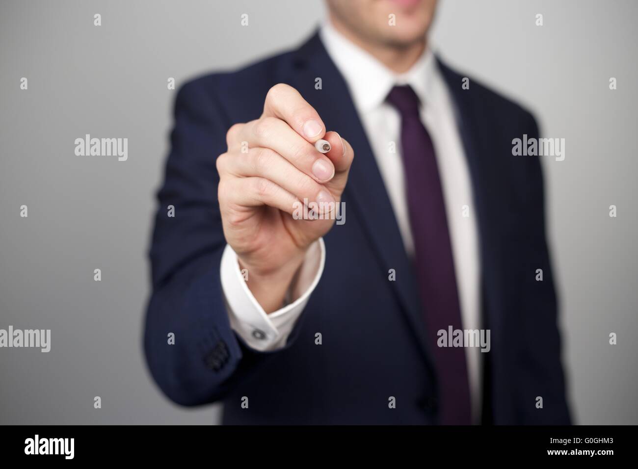 Business man writing on whiteboard Stock Photo - Alamy