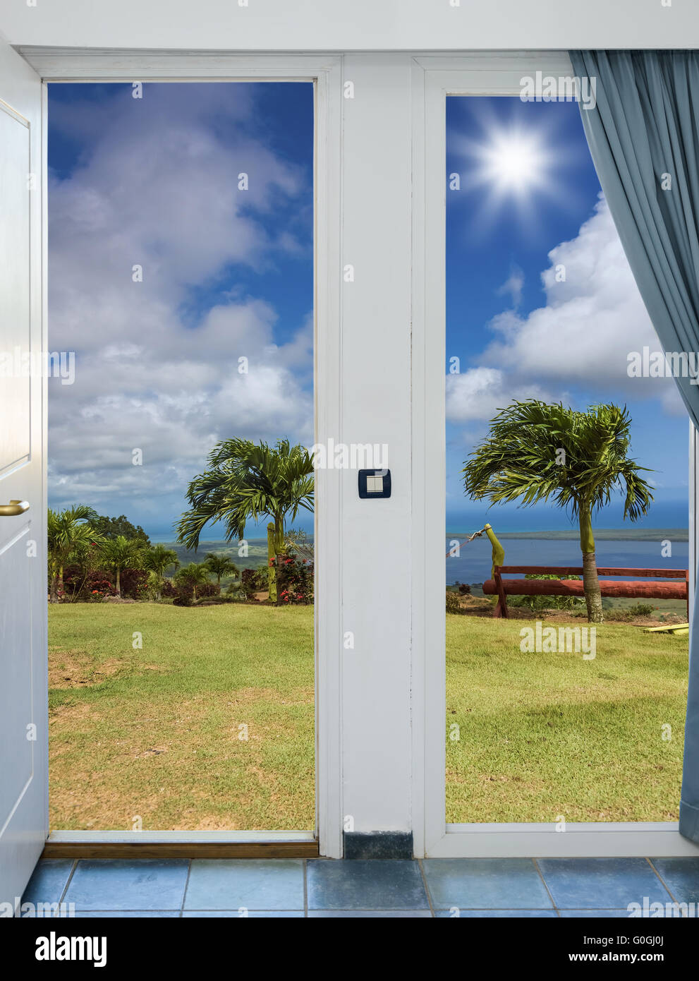 open door with access to the beach view of palms Stock Photo - Alamy