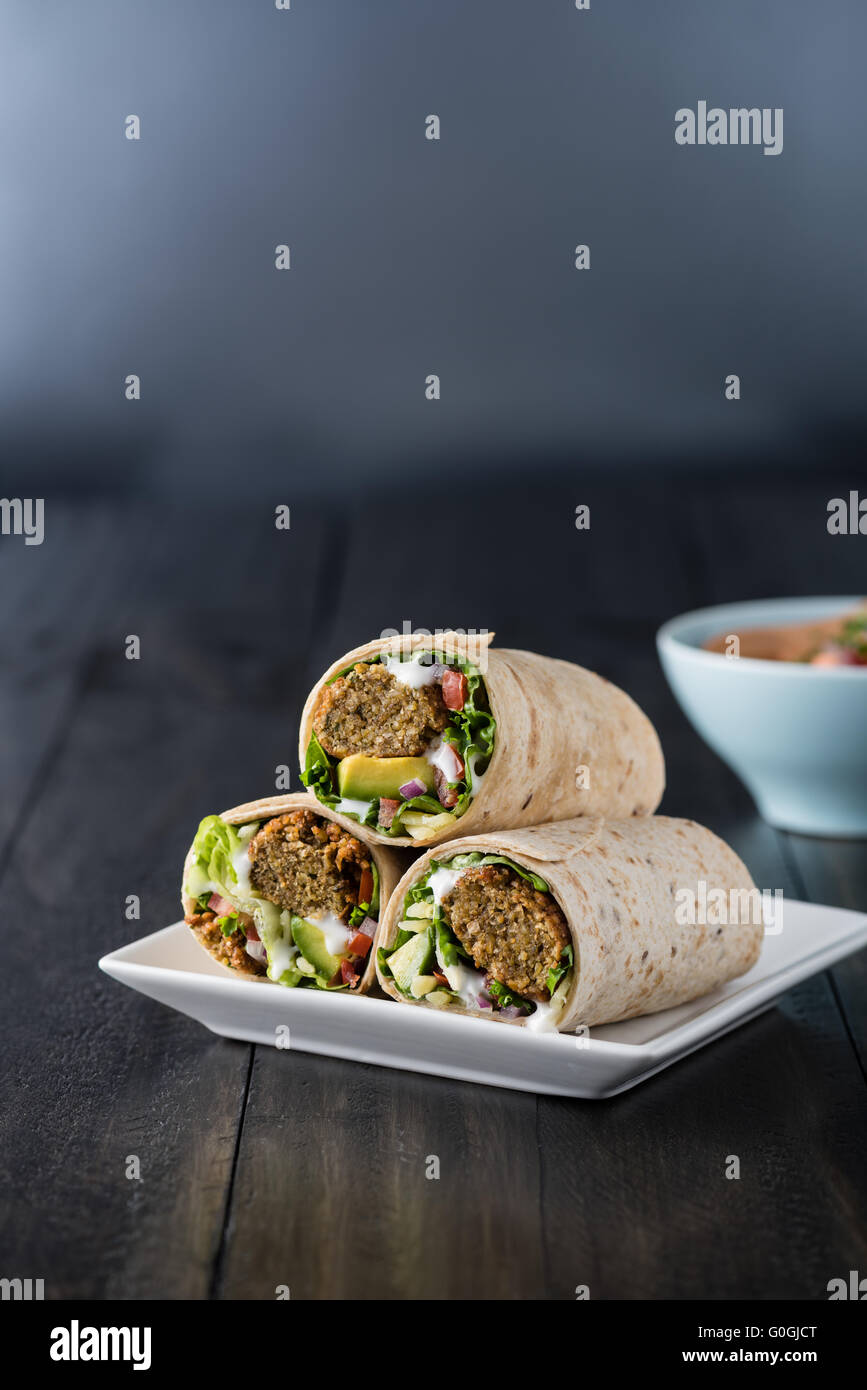 Vegetarian falafel wraps with avocado and cheese Stock Photo - Alamy