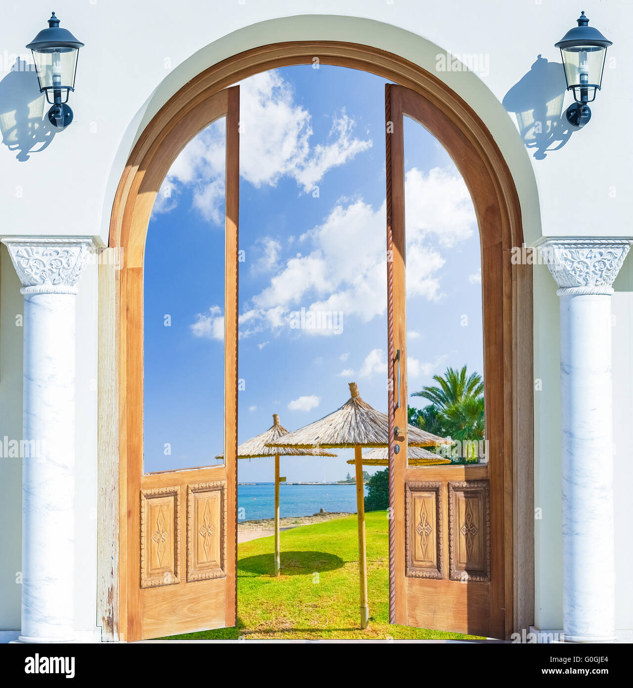open the door with the key views of the sea beach with an umbrella and ...
