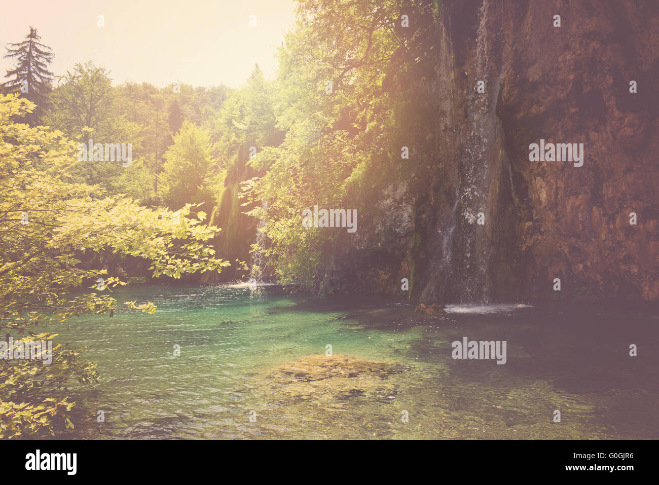 Retro Waterfall with Sunlight with Vintage Film Style Stock Photo - Alamy
