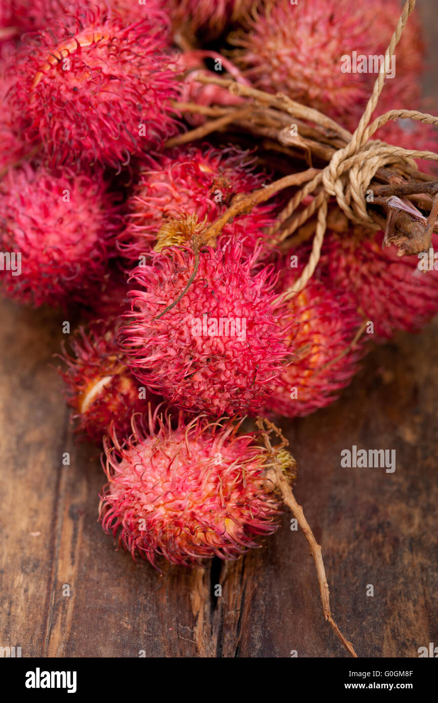 Red hairy fruits hi-res stock photography and images - Alamy