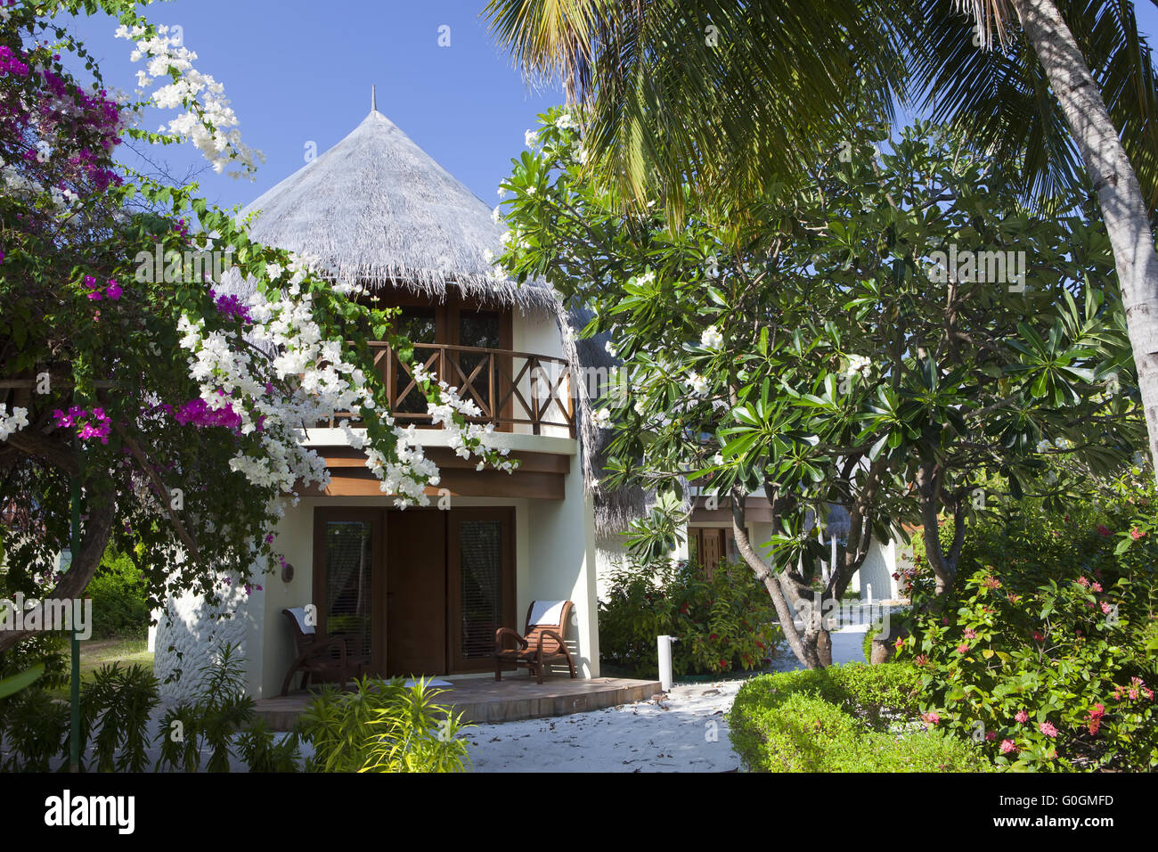 Traditional tropical hut in a garden Stock Photo - Alamy