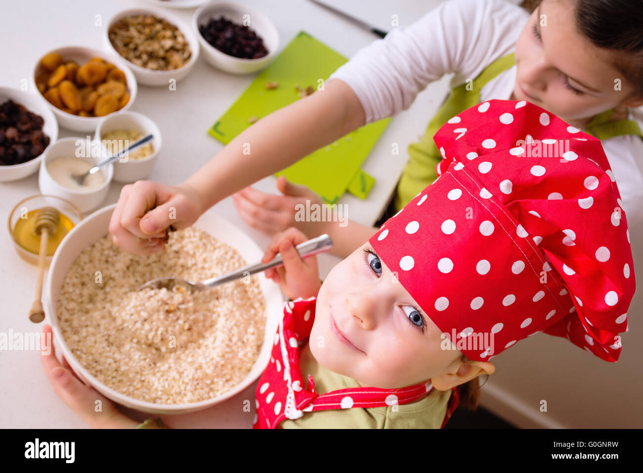 Sisters cooking hi-res stock photography and images - Alamy