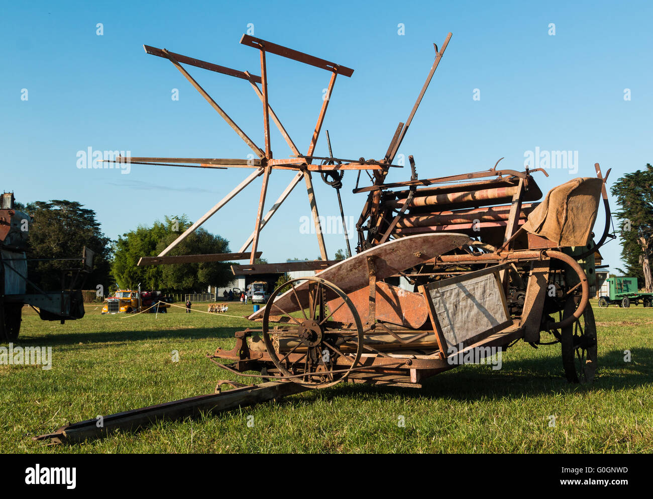 One vintage crop harvester on display Stock Photo - Alamy