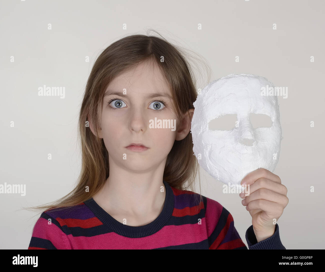 afraid little girl with plaster mask Stock Photo - Alamy