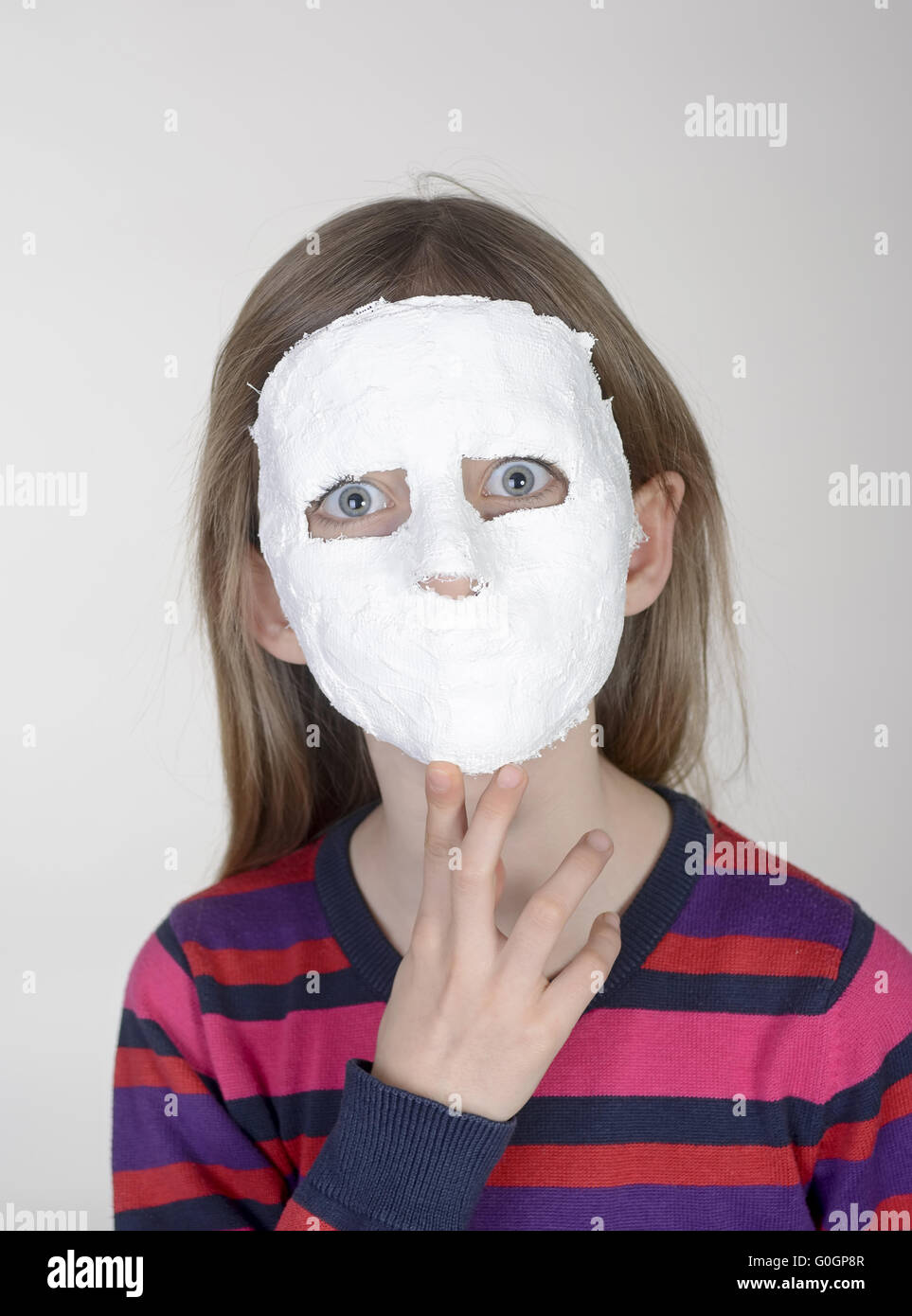 blond little girl with plaster mask Stock Photo - Alamy