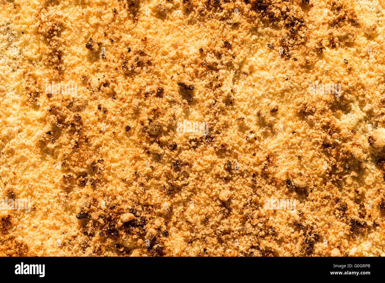 Apple crumble topping surface texture Stock Photo - Alamy